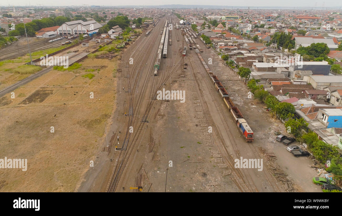 freight train with cisterns and containers on railway station Surabaya ...