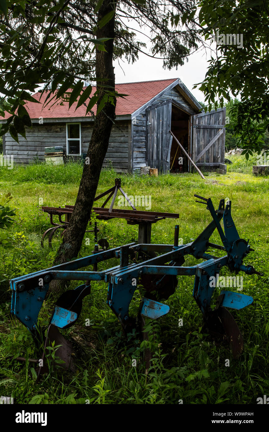 Farm tools and barn of a New England farm - BLUE HILL, MAINE Stock ...