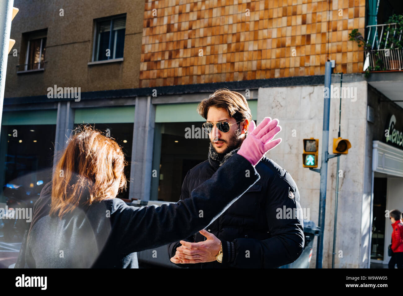 Barcelona, Spain - Nov 14, 2017: Side view of woman gesticulating with ...