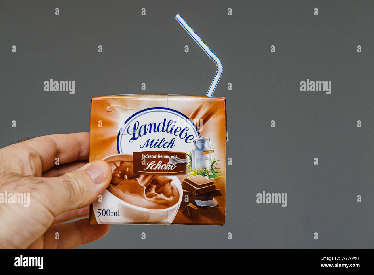 Paris, France - Mar 16, 2019: Man hand holding Landliebe Milch milk ...