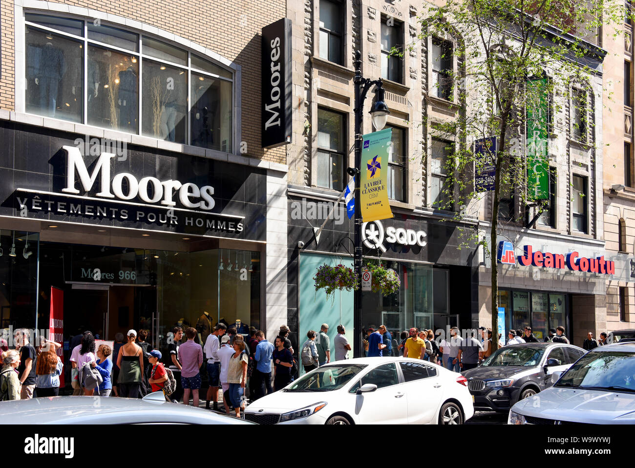Montreal, Quebec, Canada - August 10, 2019: A big crowd of people stand ...