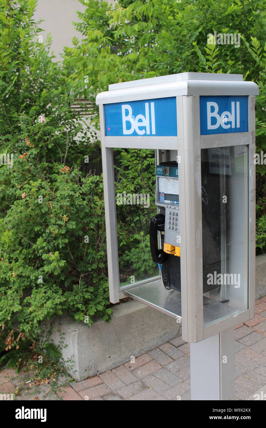 A payphone stands on a public sidewalk Stock Photo - Alamy