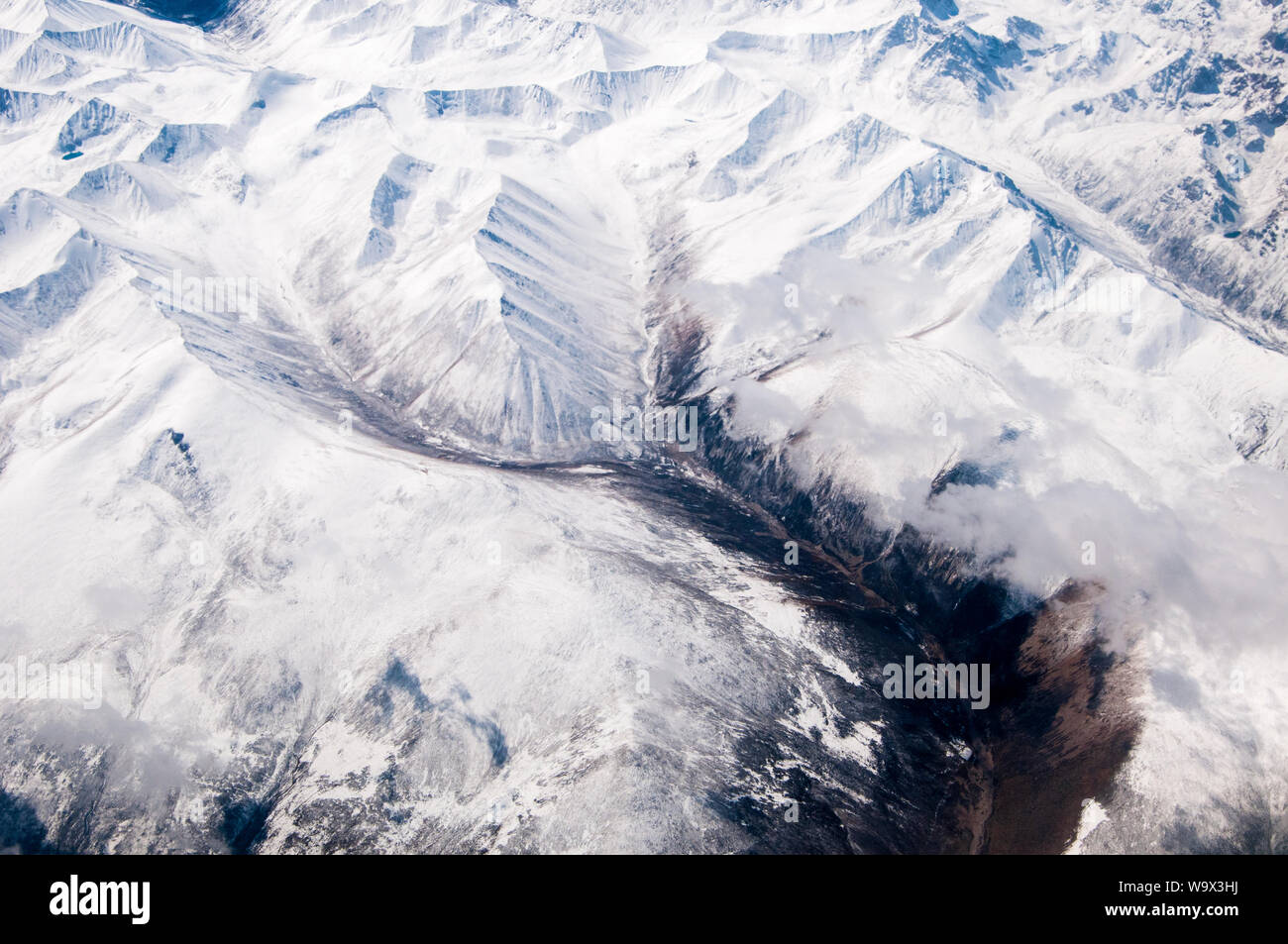 Aerial over the Himalayas of eastern Tibet, China, revealing a deep ...