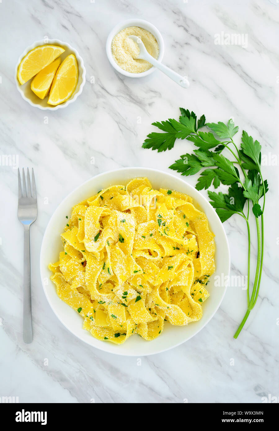 Pappardelle Italian egg pasta with lemon and parmesan cheese on marble ...
