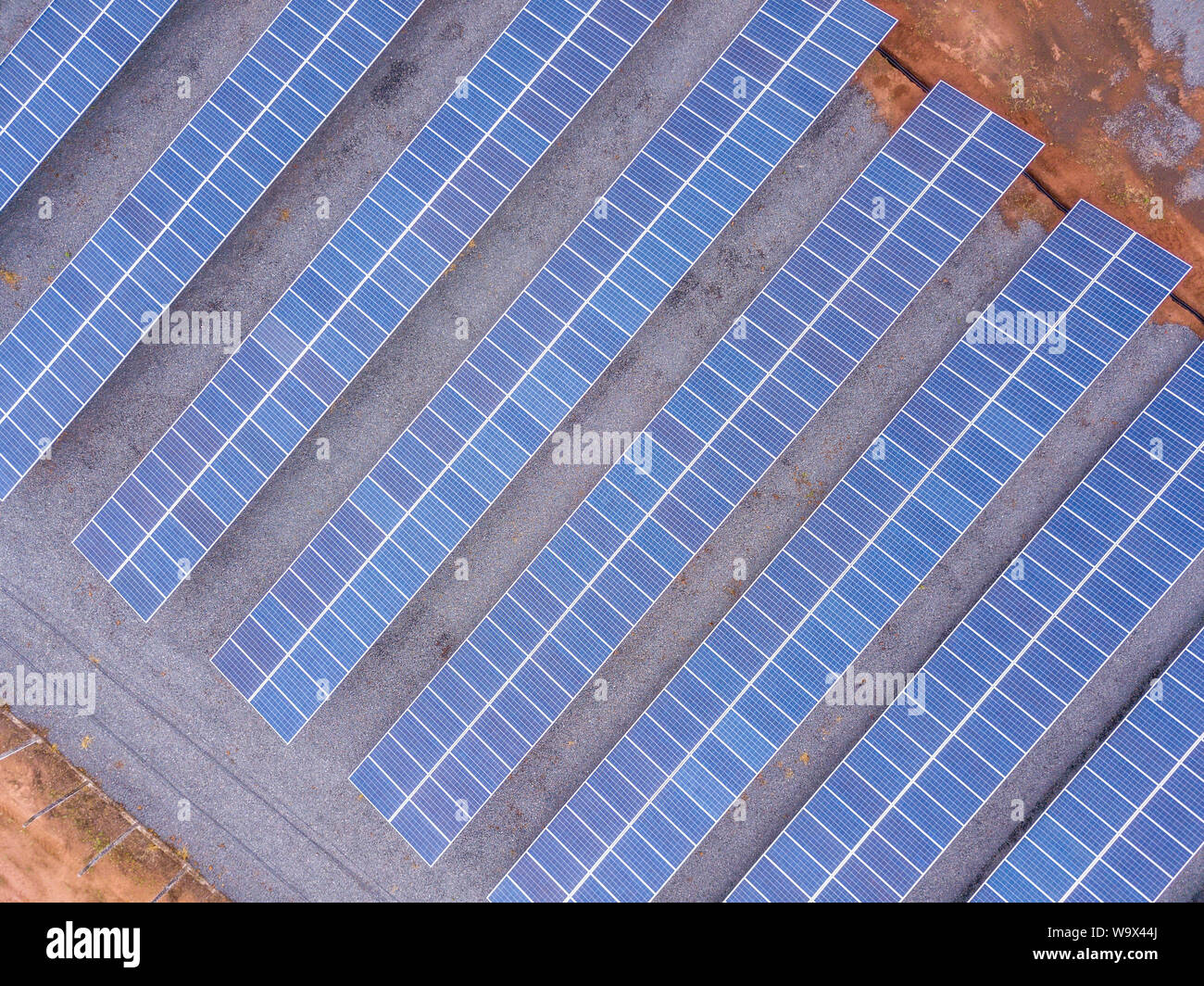 Aerial view of solar panels in factory using clean and renewable energy ...
