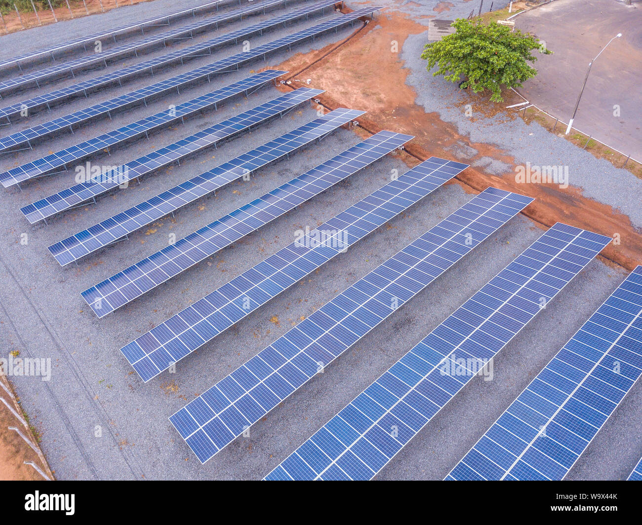 Aerial view of solar panels in factory using clean and renewable energy ...