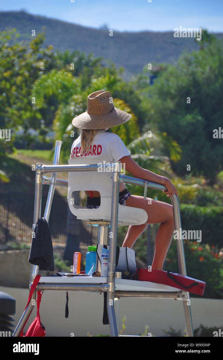 A life guard watches over the Olympic size pool on the Campus of ...