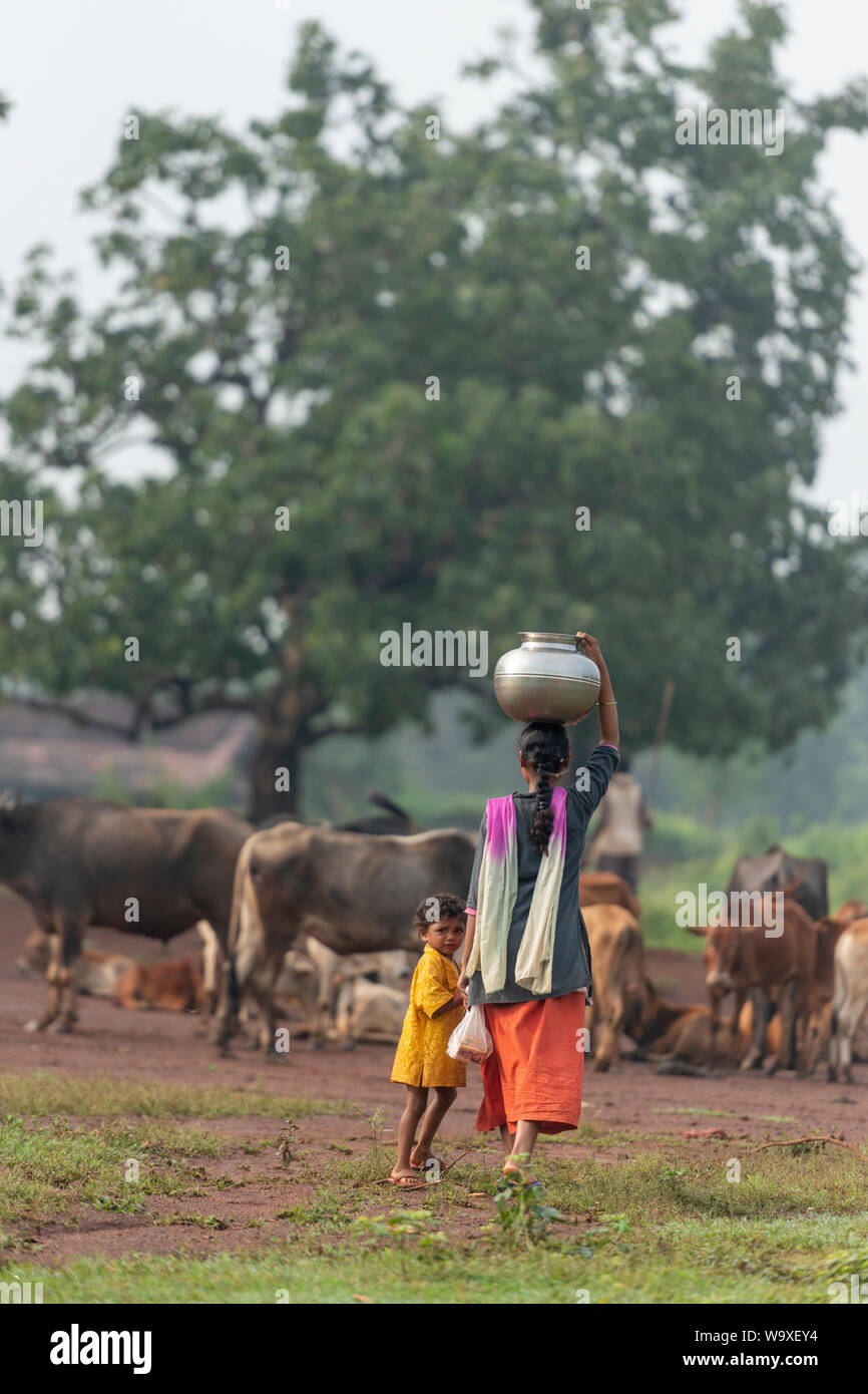 Mother and child fething potable water near jagdalpur,Chhattisgarh ...