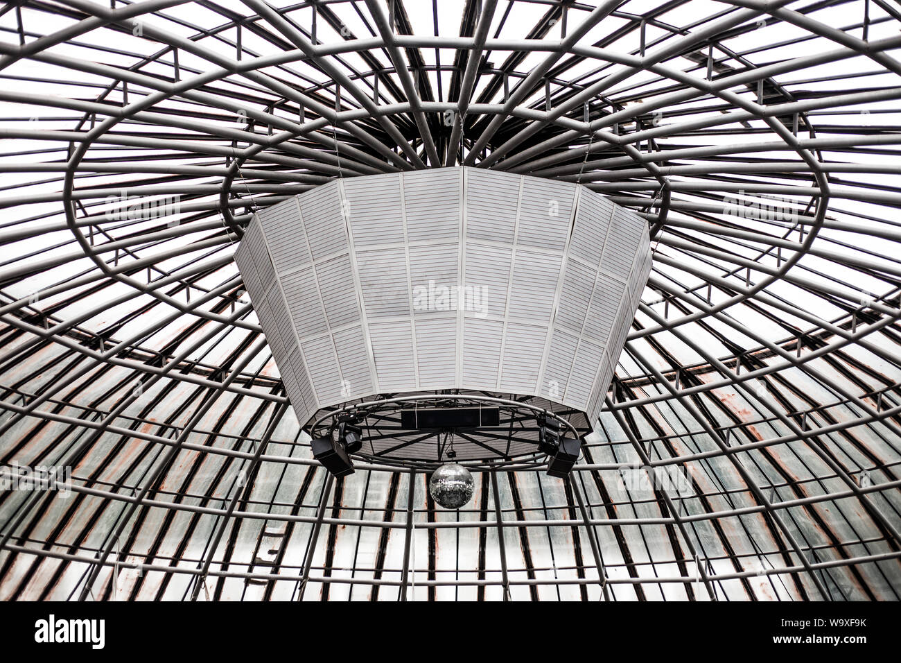 Abstract geometric shapes if a curved metal and glass ceiling of a ...