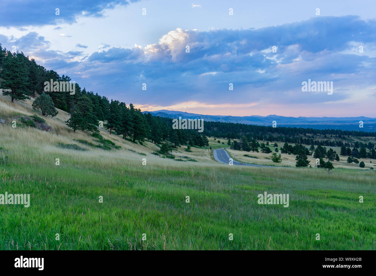 Sunset over Boulder colorado as seen from mountain road flatirons ...