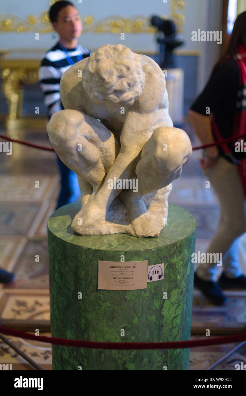 Statue of crouching boy in the Hermitage in Saint Petersburg, Russia ...