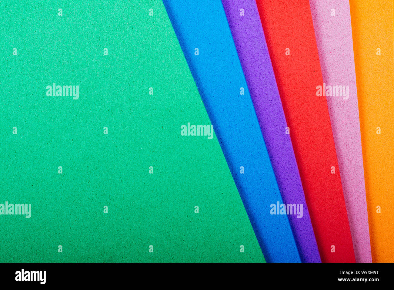 Colorful objects make mixed multi color background Stock Photo - Alamy