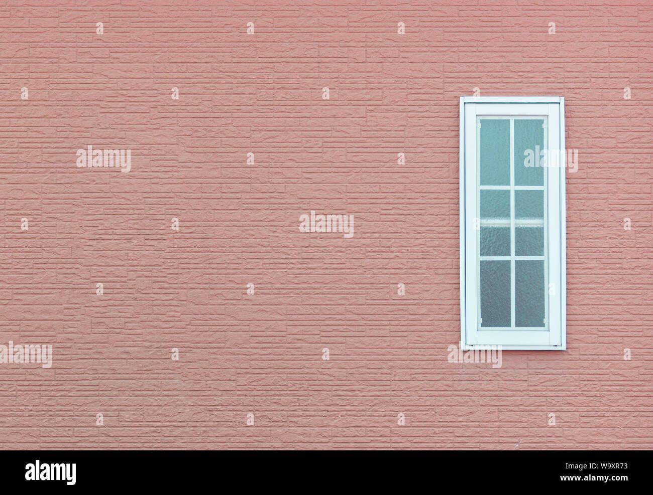 Modern windows and Detail of house exterior red wall Stock Photo - Alamy
