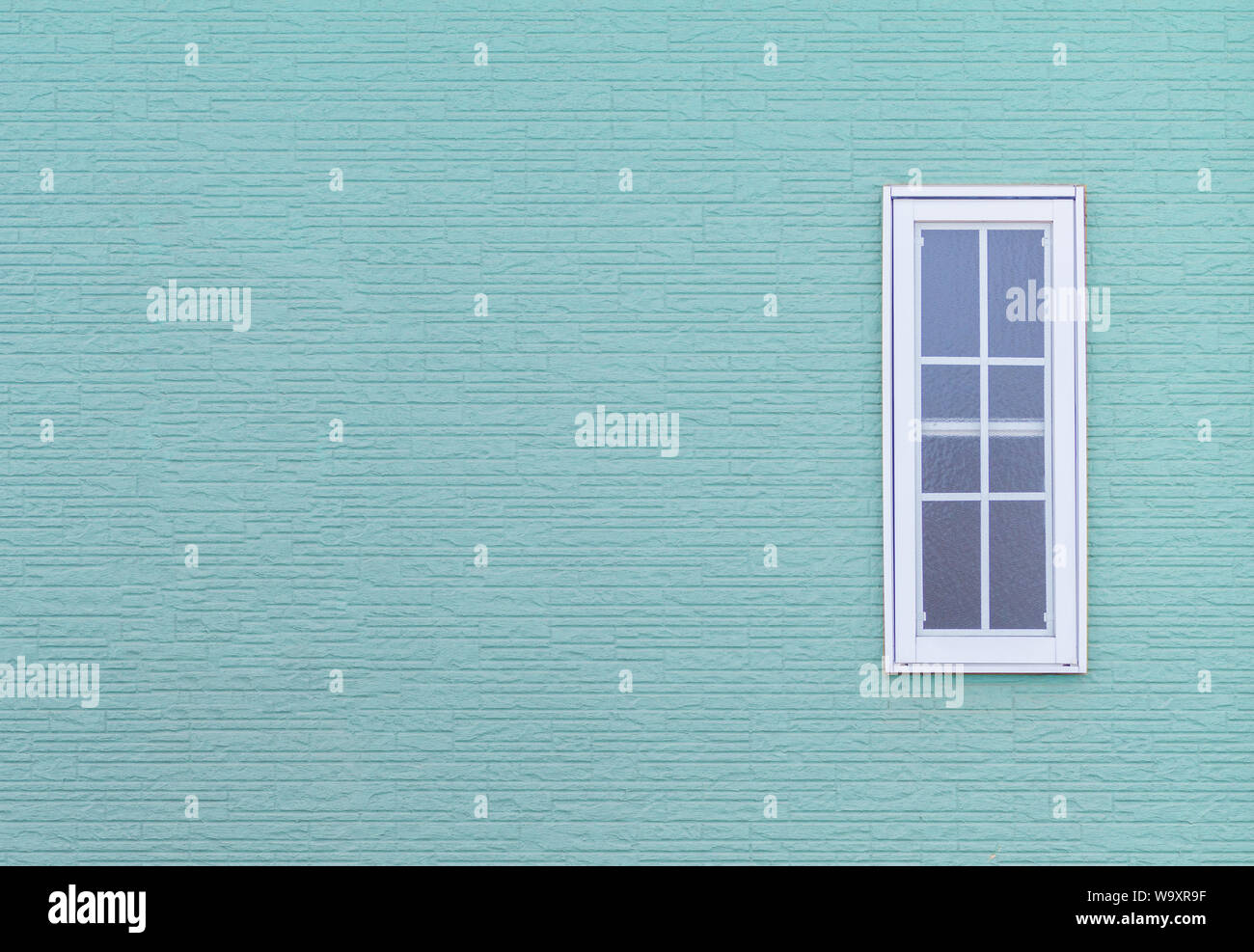 Modern windows and Detail of house exterior blue wall Stock Photo - Alamy