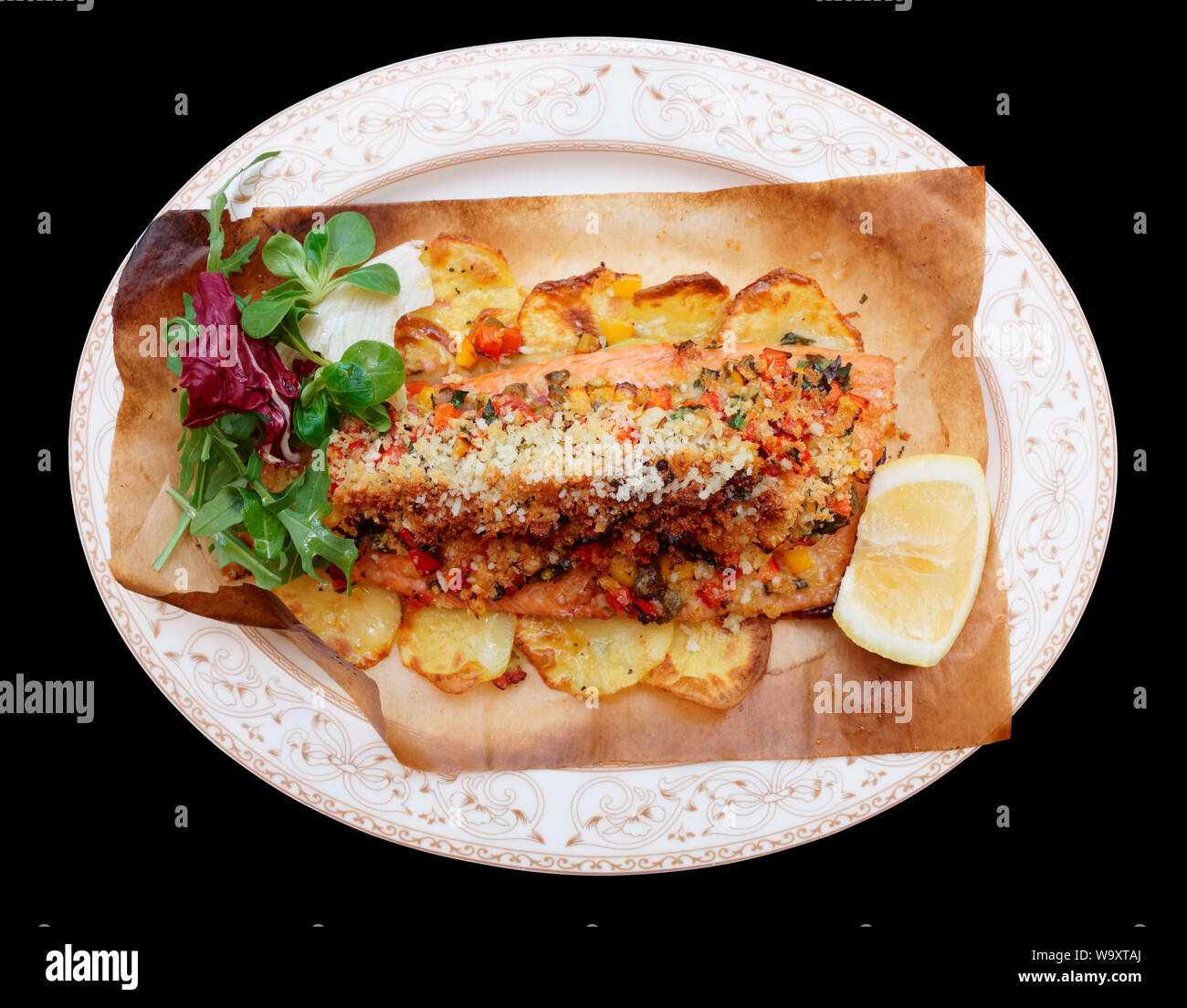 Baked trout with vegetables and bread crumbs, Italian dish, isolated on ...