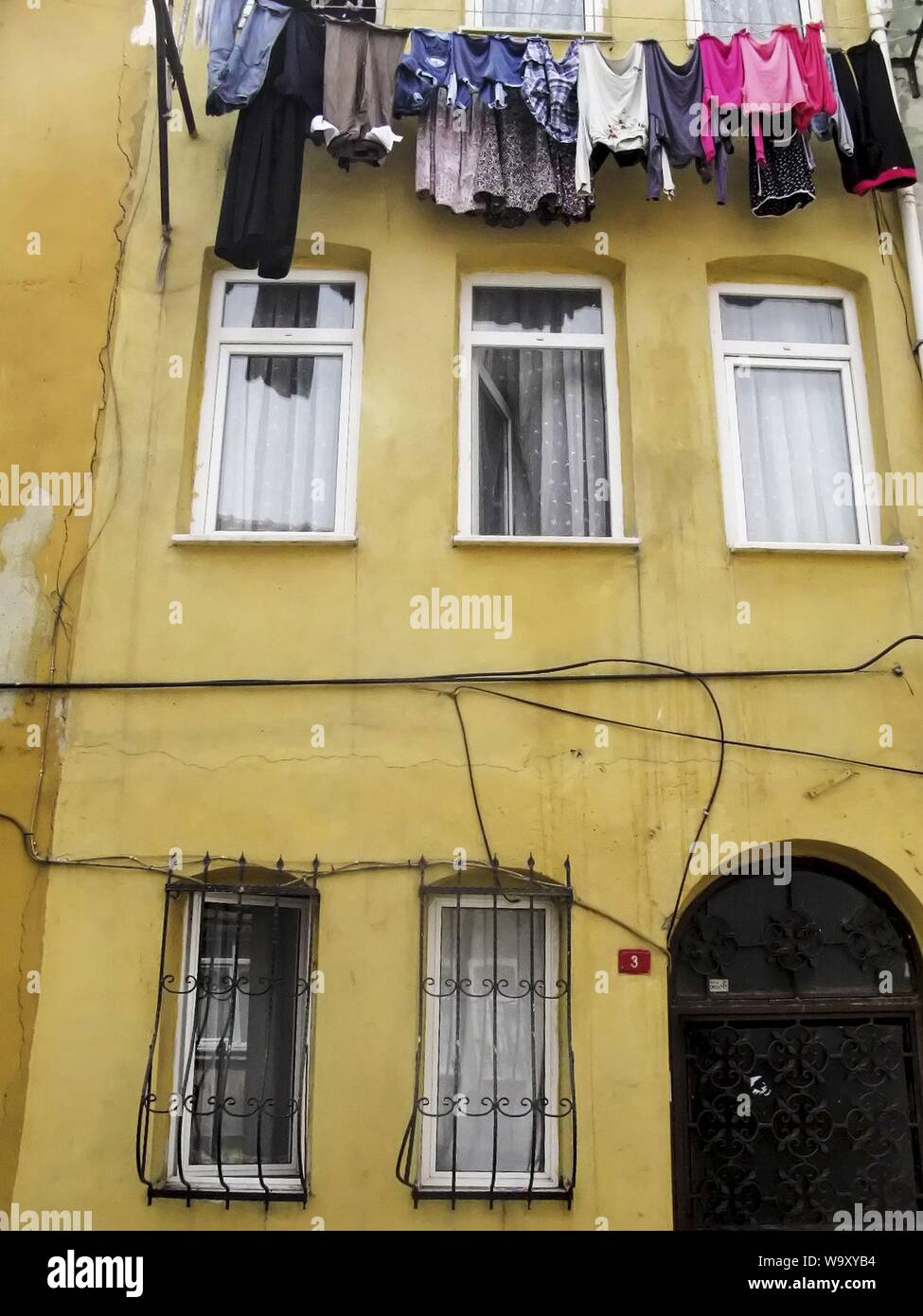 Daily Life In Istanbul. Drying cloths between two buildings in Balat ...