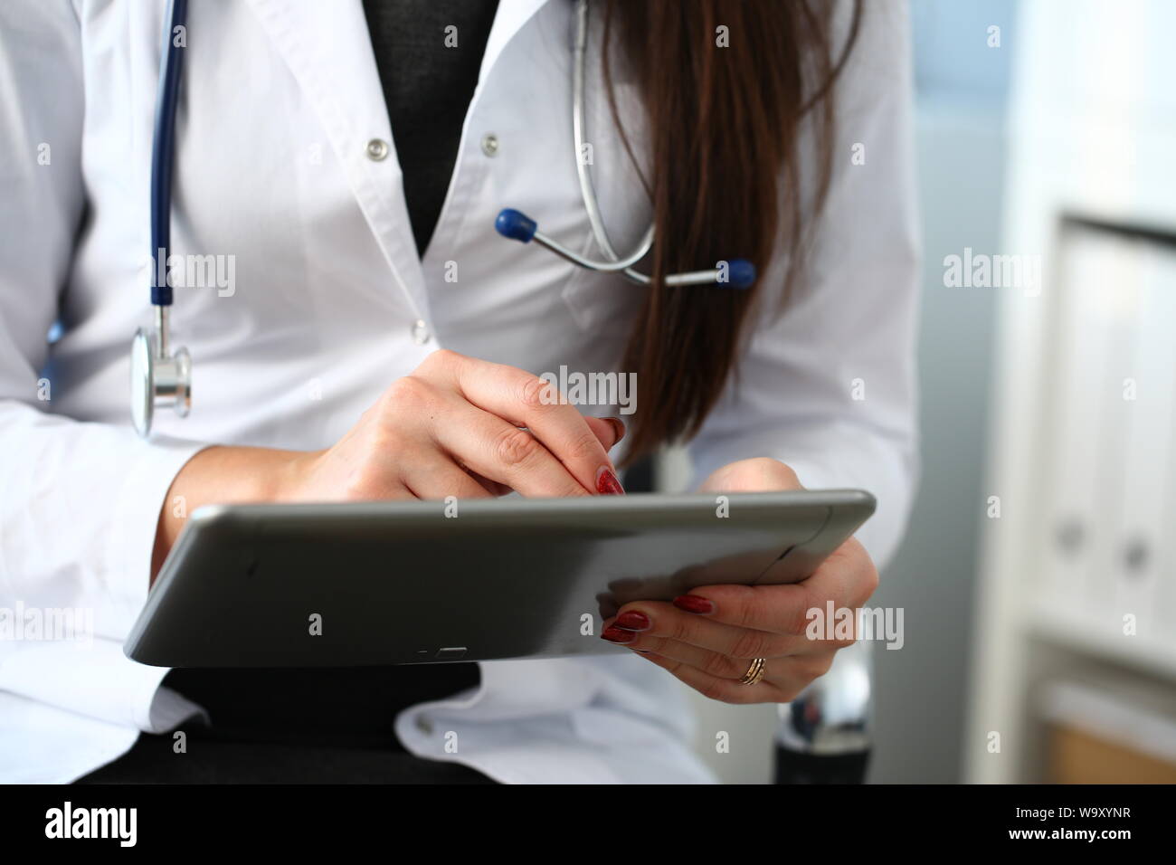Female doctor hands hold and show digital Stock Photo - Alamy