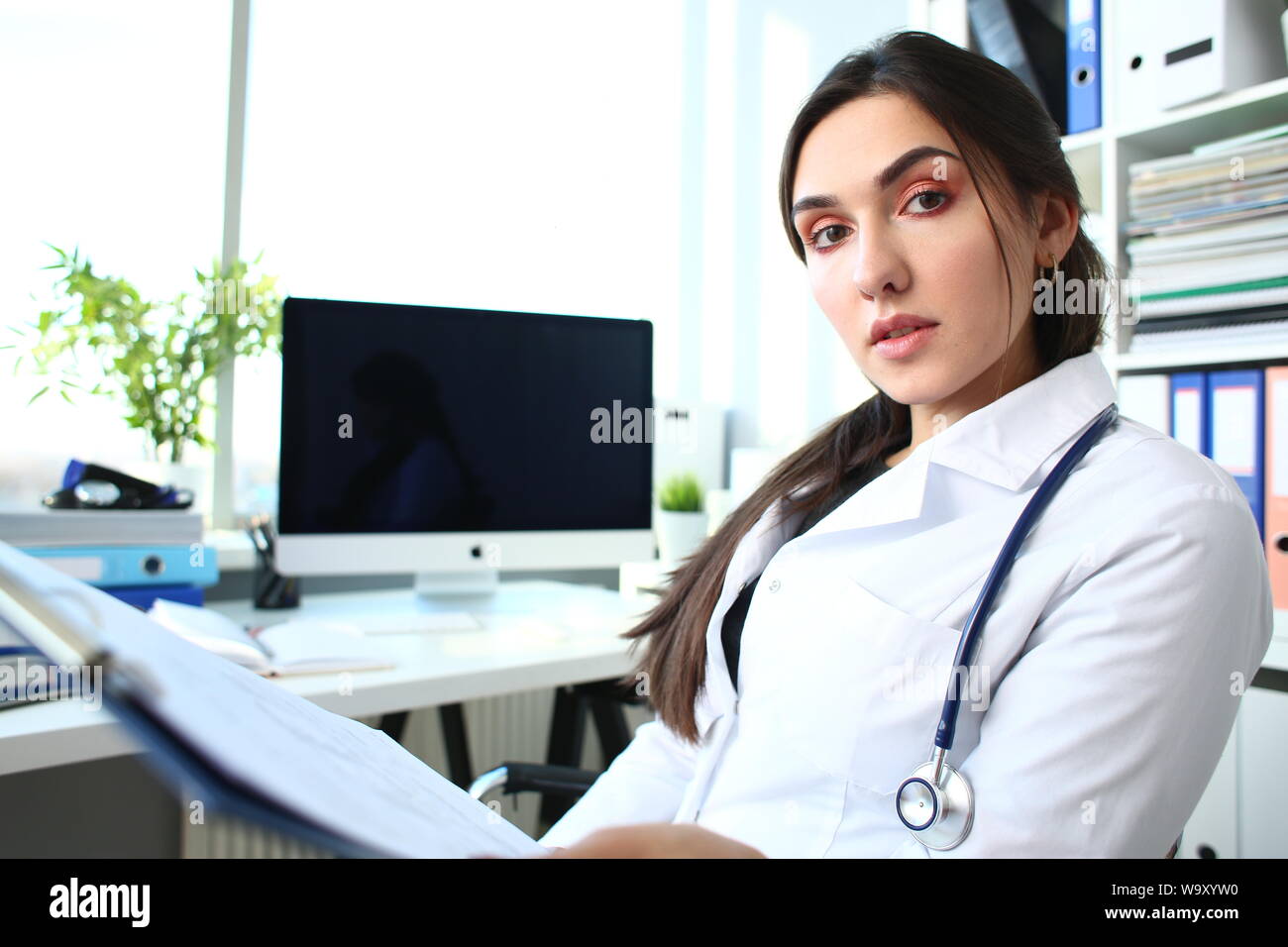 Beautiful smiling female doctor at workplace portrait Stock Photo - Alamy