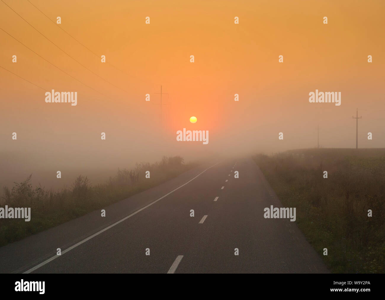 sunset light in fog. road trip, transportation concept Stock Photo - Alamy