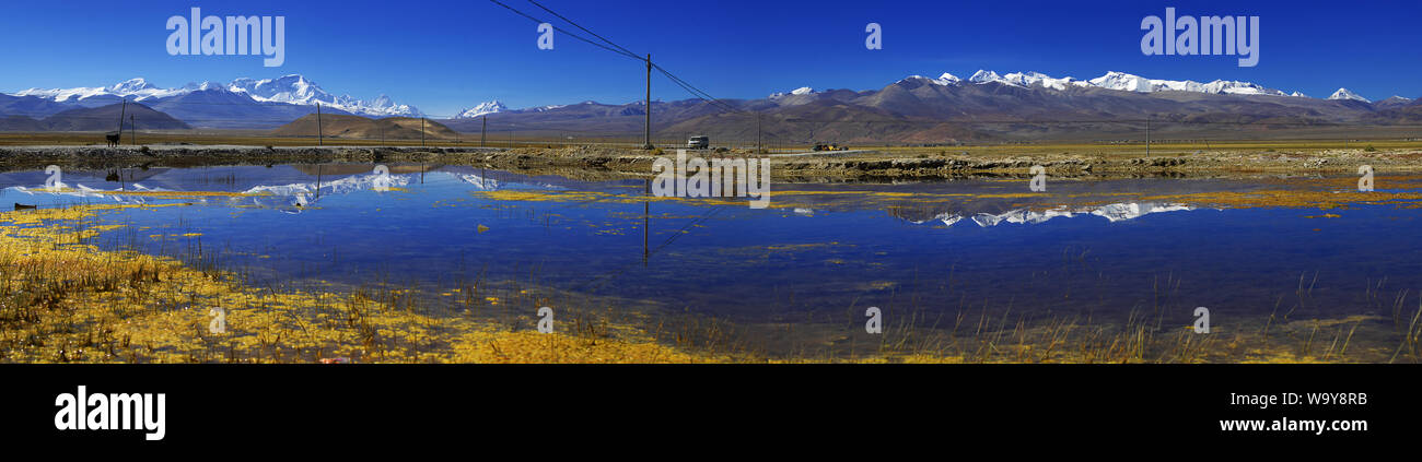 Snow mountain peaks reflection Stock Photo - Alamy