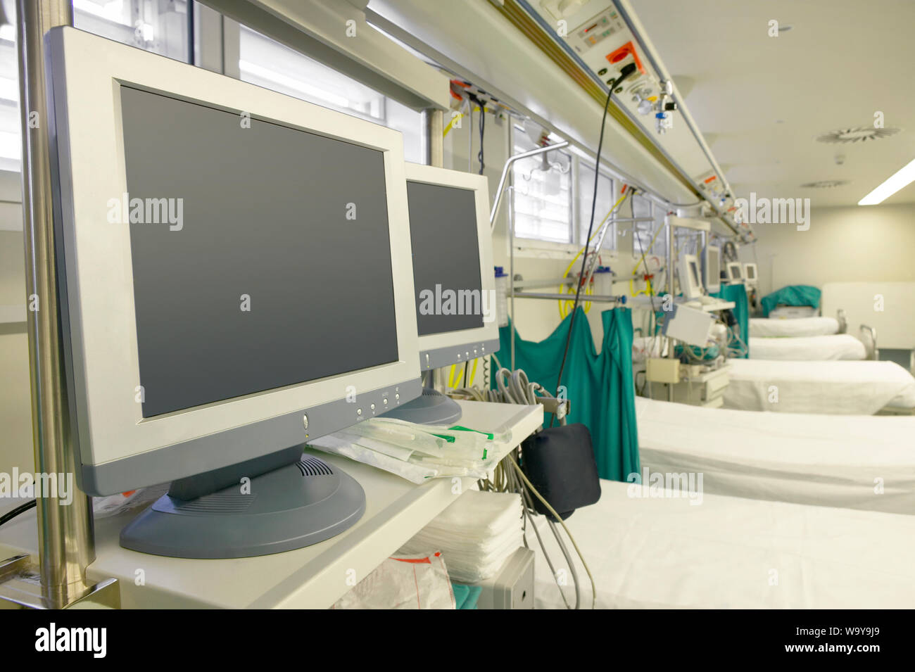 Hospital intensive care unit area with beds equipment. Health center ...