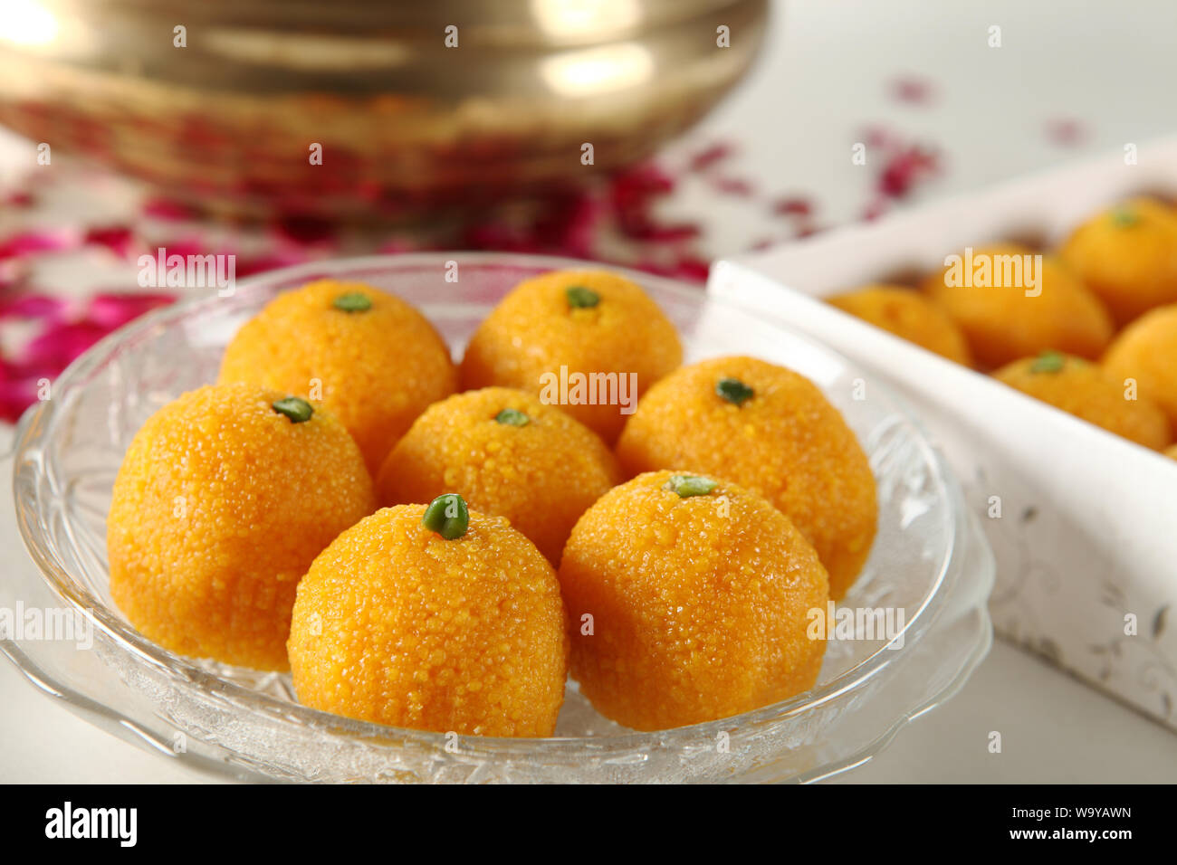Close up of a laddoo in a glass bowl Stock Photo - Alamy