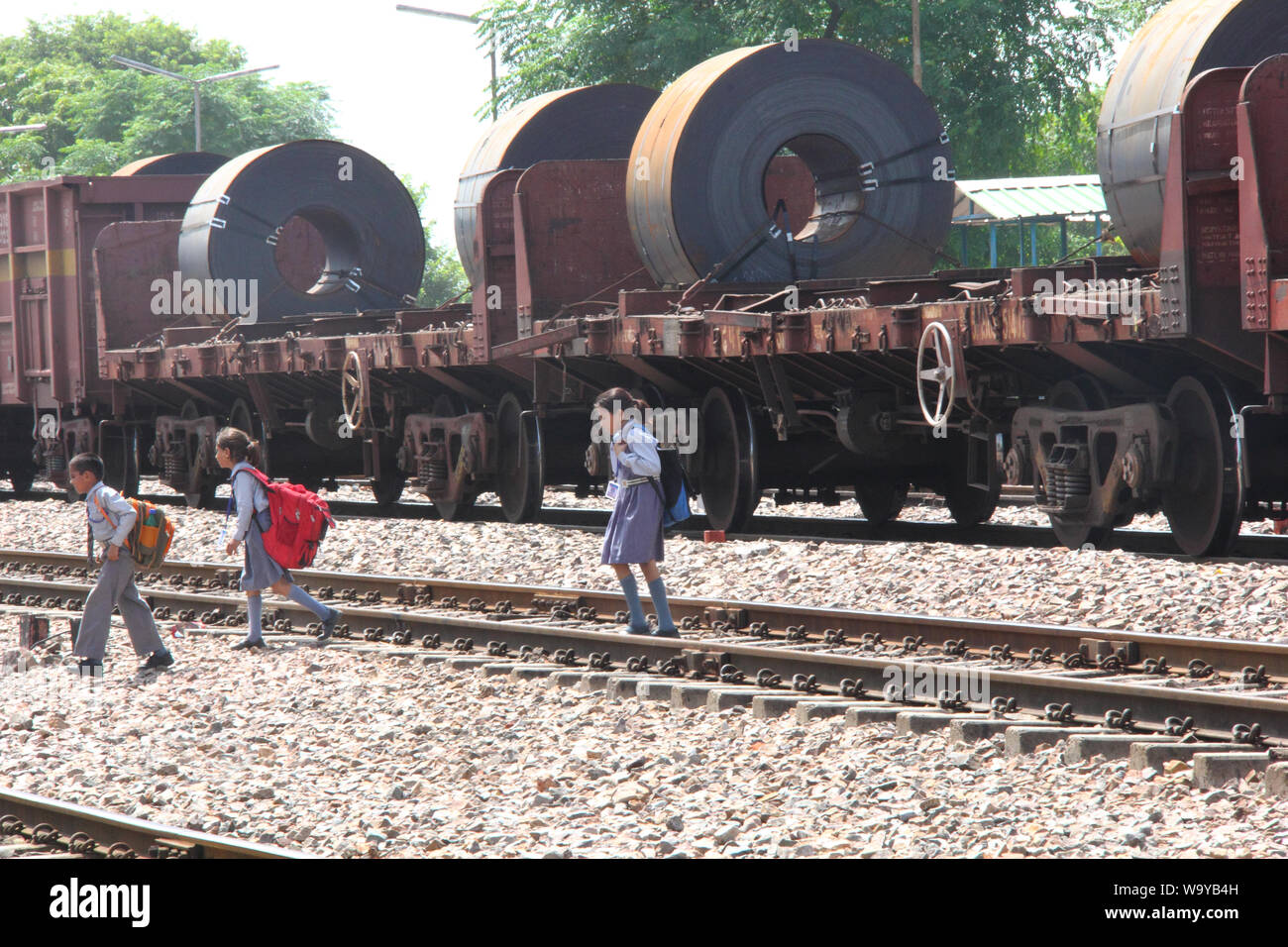 School children walking on railway tracks Stock Photo - Alamy