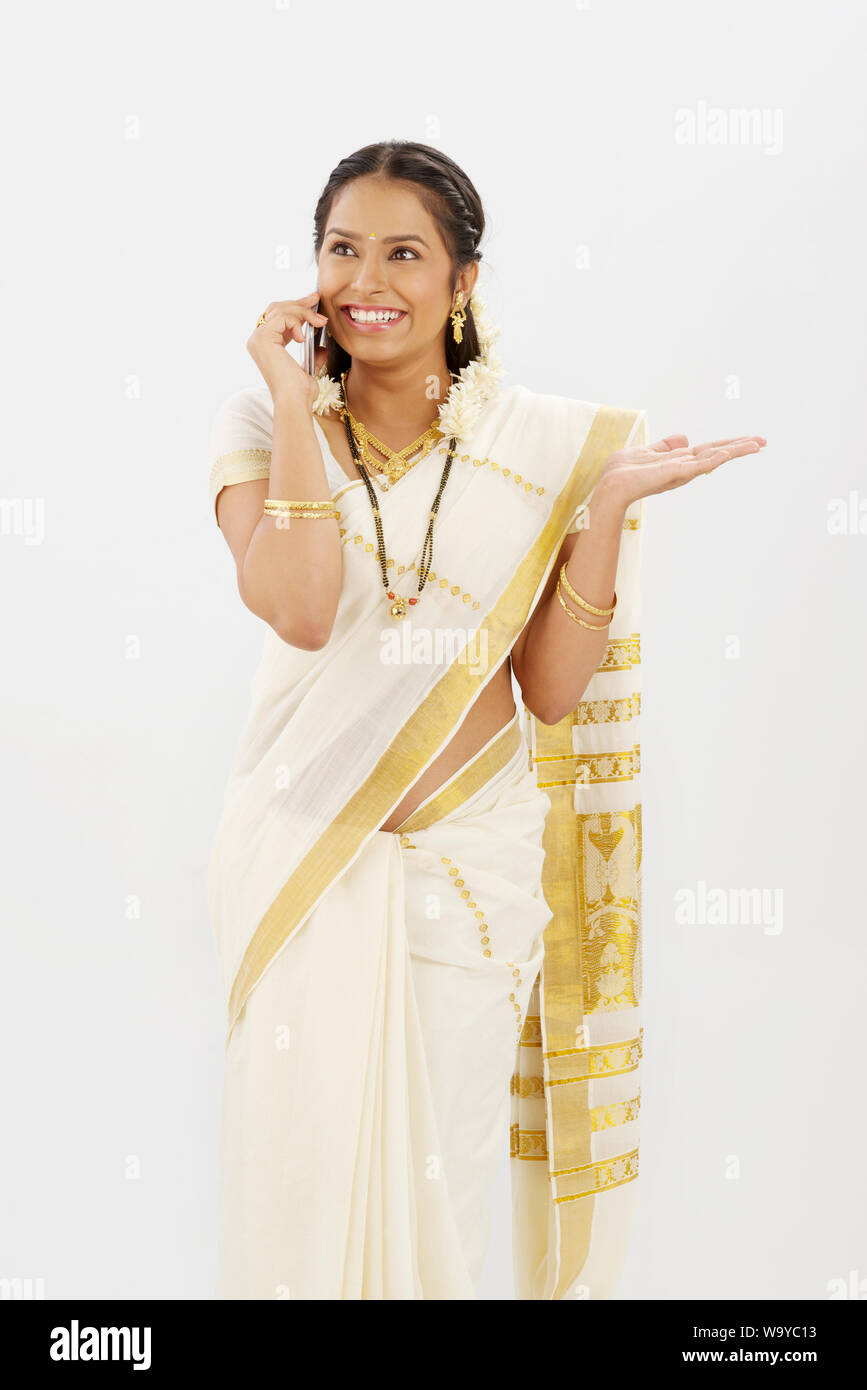 South Indian woman talking on a mobile phone Stock Photo - Alamy