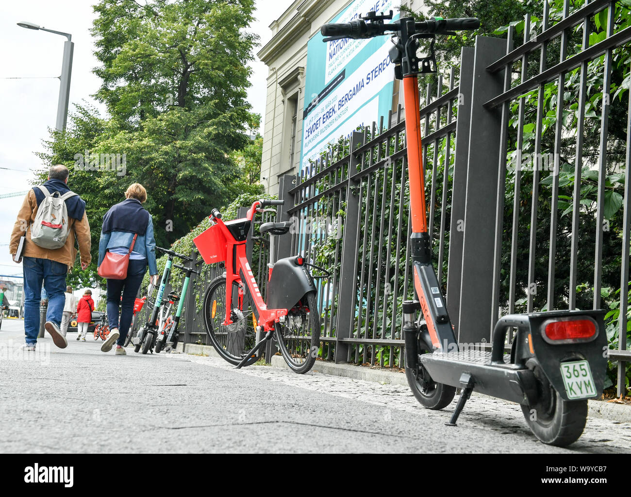 Berlin, Germany. 15th Aug, 2019. Numerous e-bikes and e-scooters stand ...