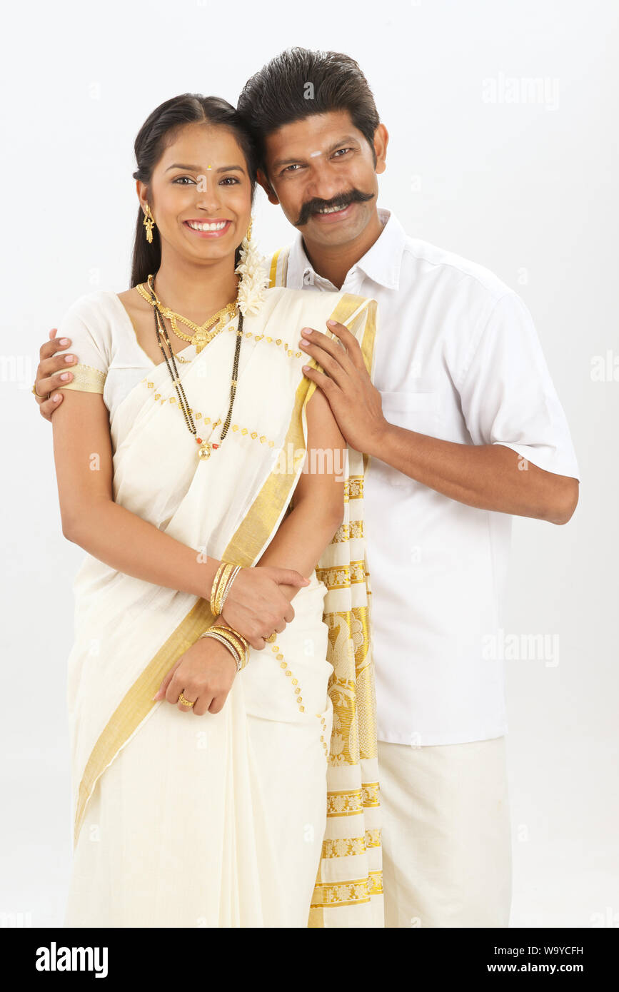 South Indian couple standing together and smiling Stock Photo - Alamy
