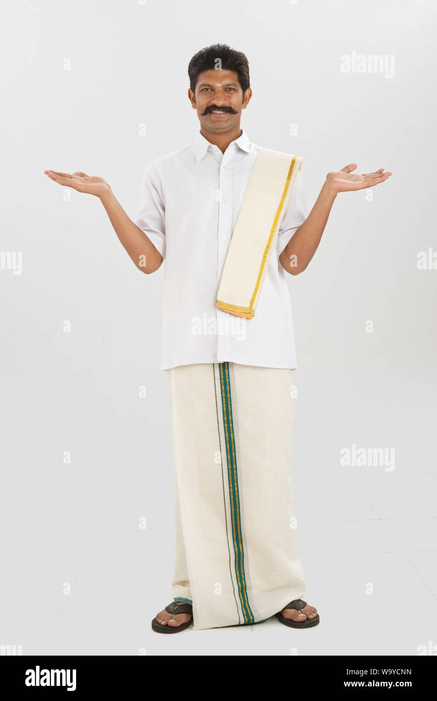 South Indian man smiling and gesturing Stock Photo - Alamy