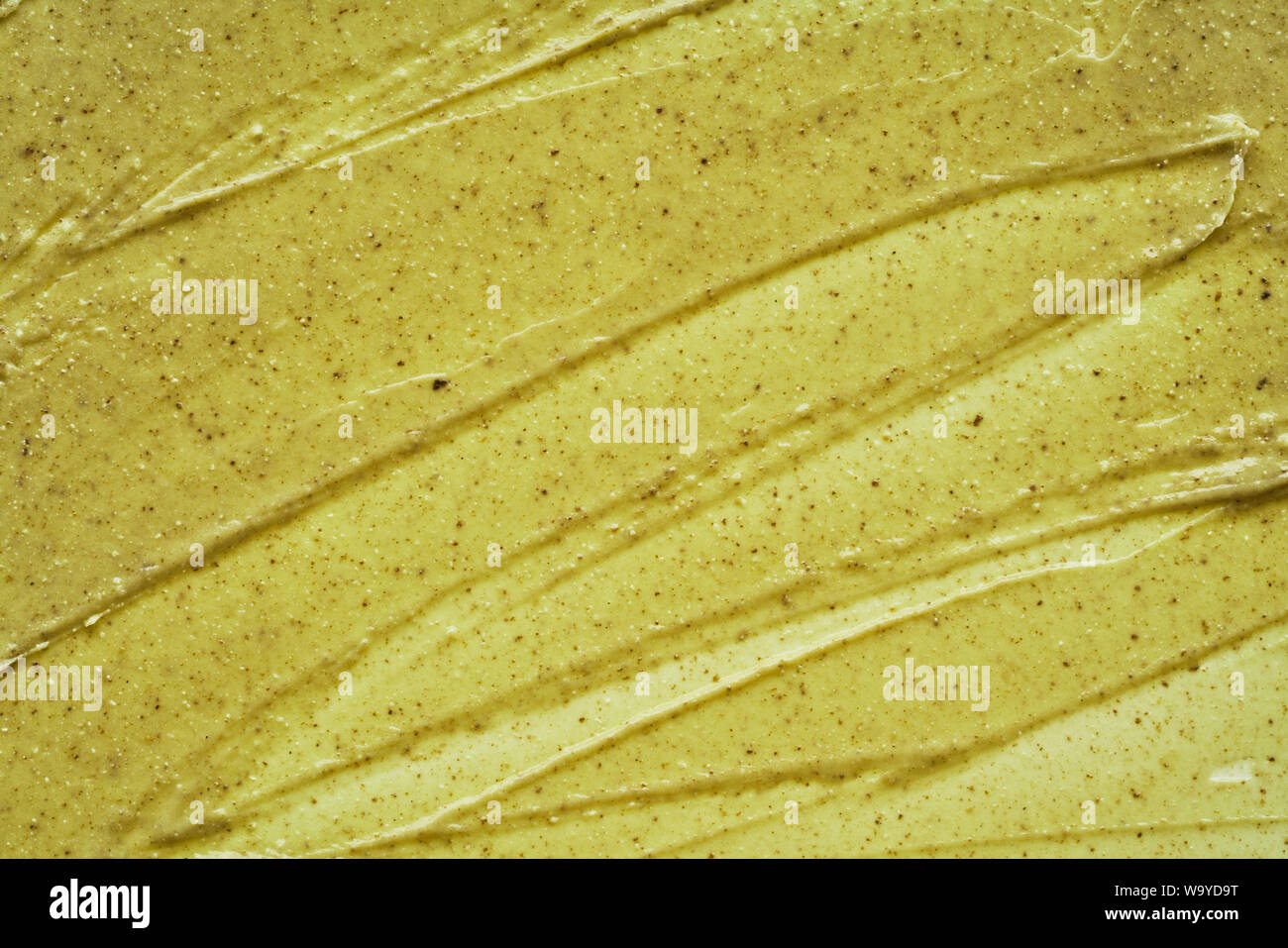 Texture and strokes of a light green organic mask for face or body ...