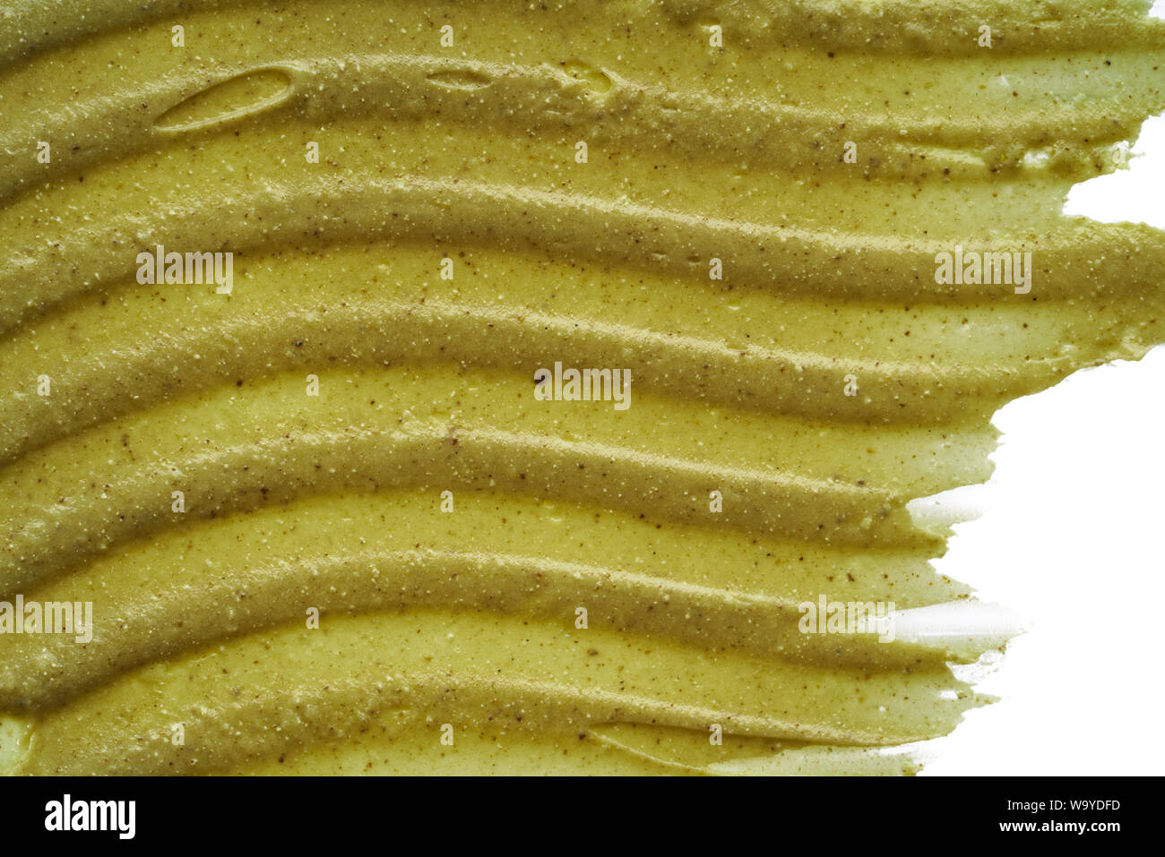 Texture and strokes of a light green organic mask for face or body ...