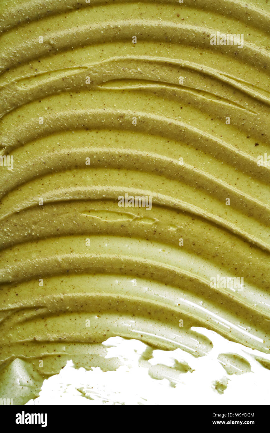 Texture and strokes of a light green organic mask for face or body ...