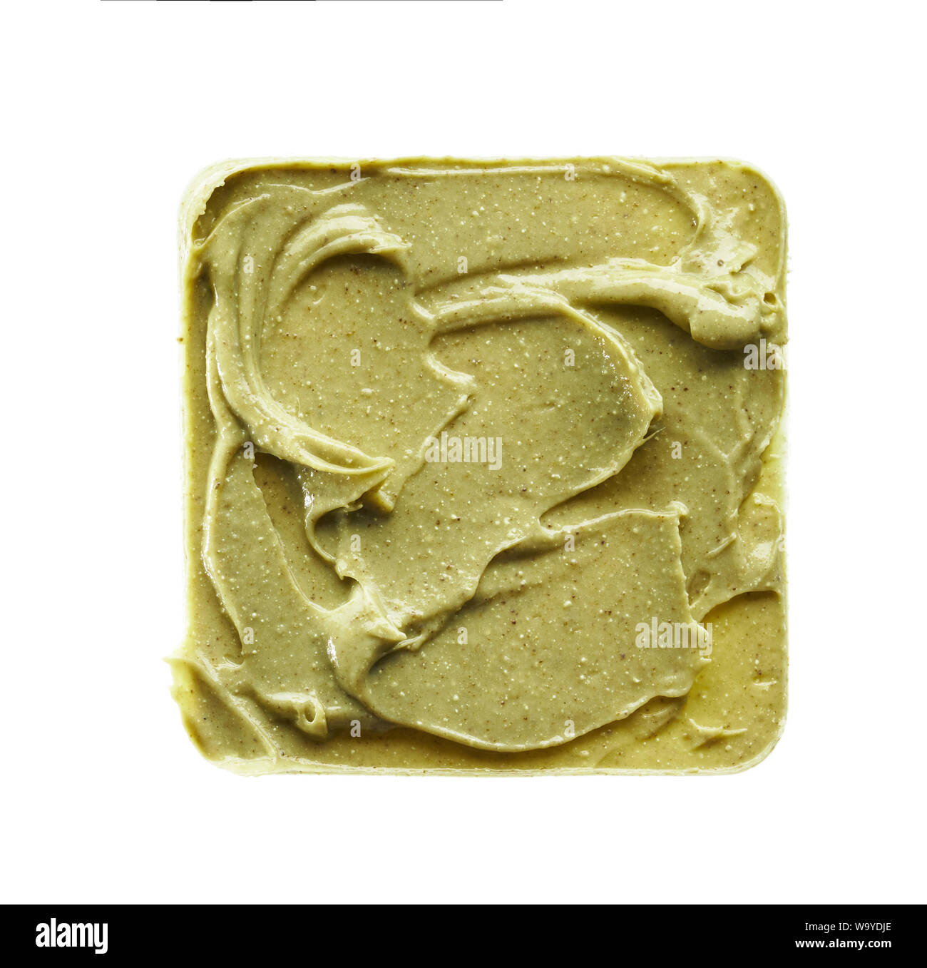 Texture and strokes of a light green organic mask for face or body ...