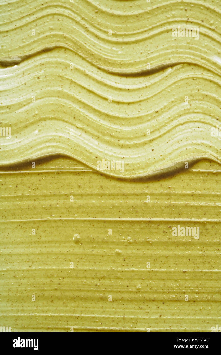 Texture and strokes of a light green organic mask for face or body ...