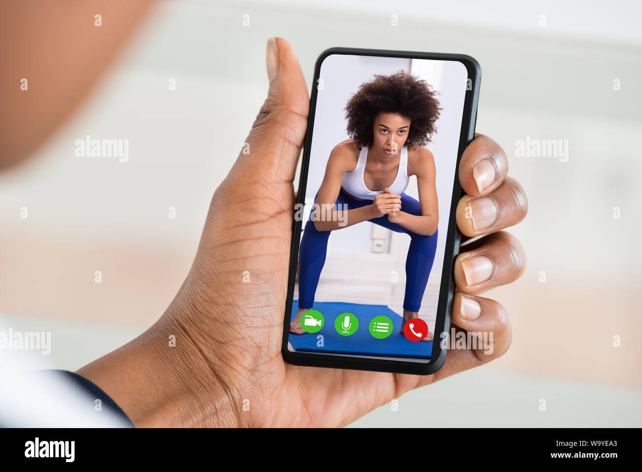 Human Doing Video Calling With Yoga Trainer On Smartphone Stock Photo ...