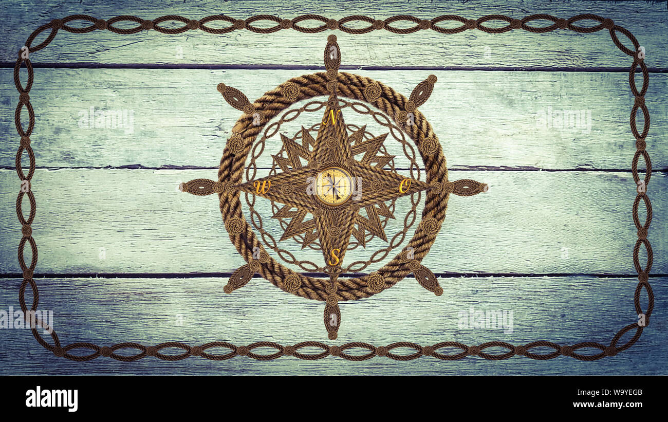 Compass anchor wheel from old ropes on wood Stock Photo - Alamy