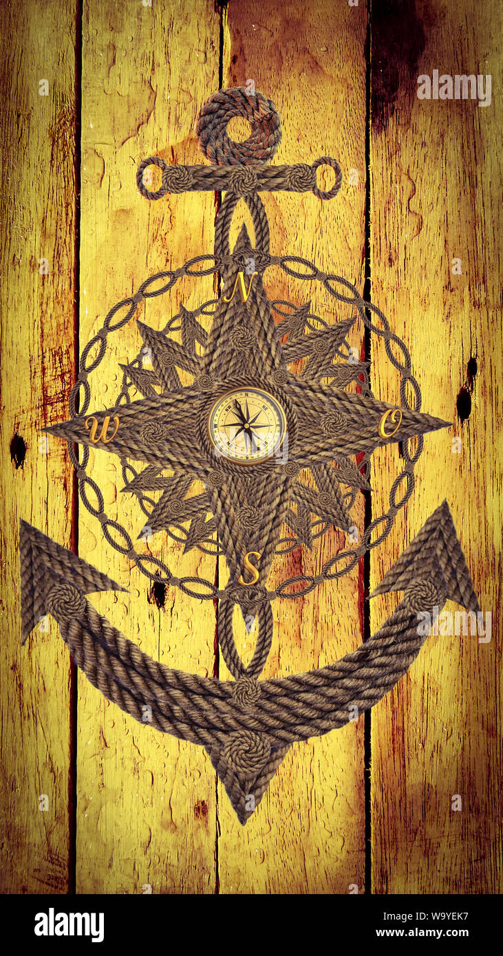 Compass anchor wheel from old ropes on wood Stock Photo - Alamy