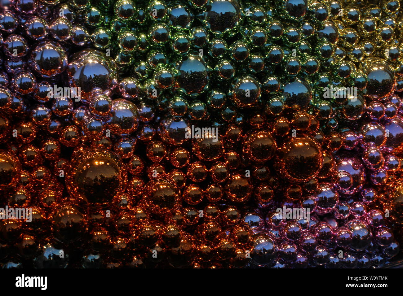 Close up of balls in a window display Stock Photo - Alamy