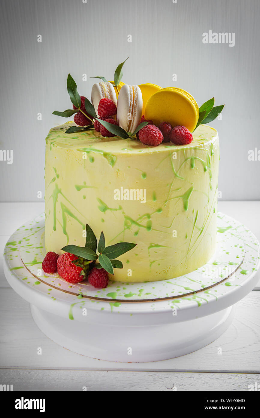 Matcha Green tea cake with macaroon, raspberries decorated with green ...