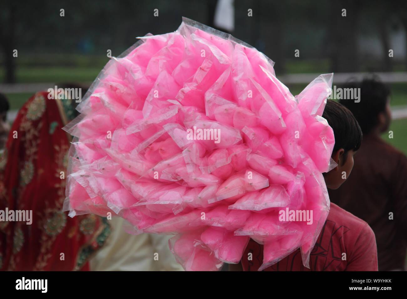 Rear view of a Hawker selling cotton candy, India Stock Photo - Alamy