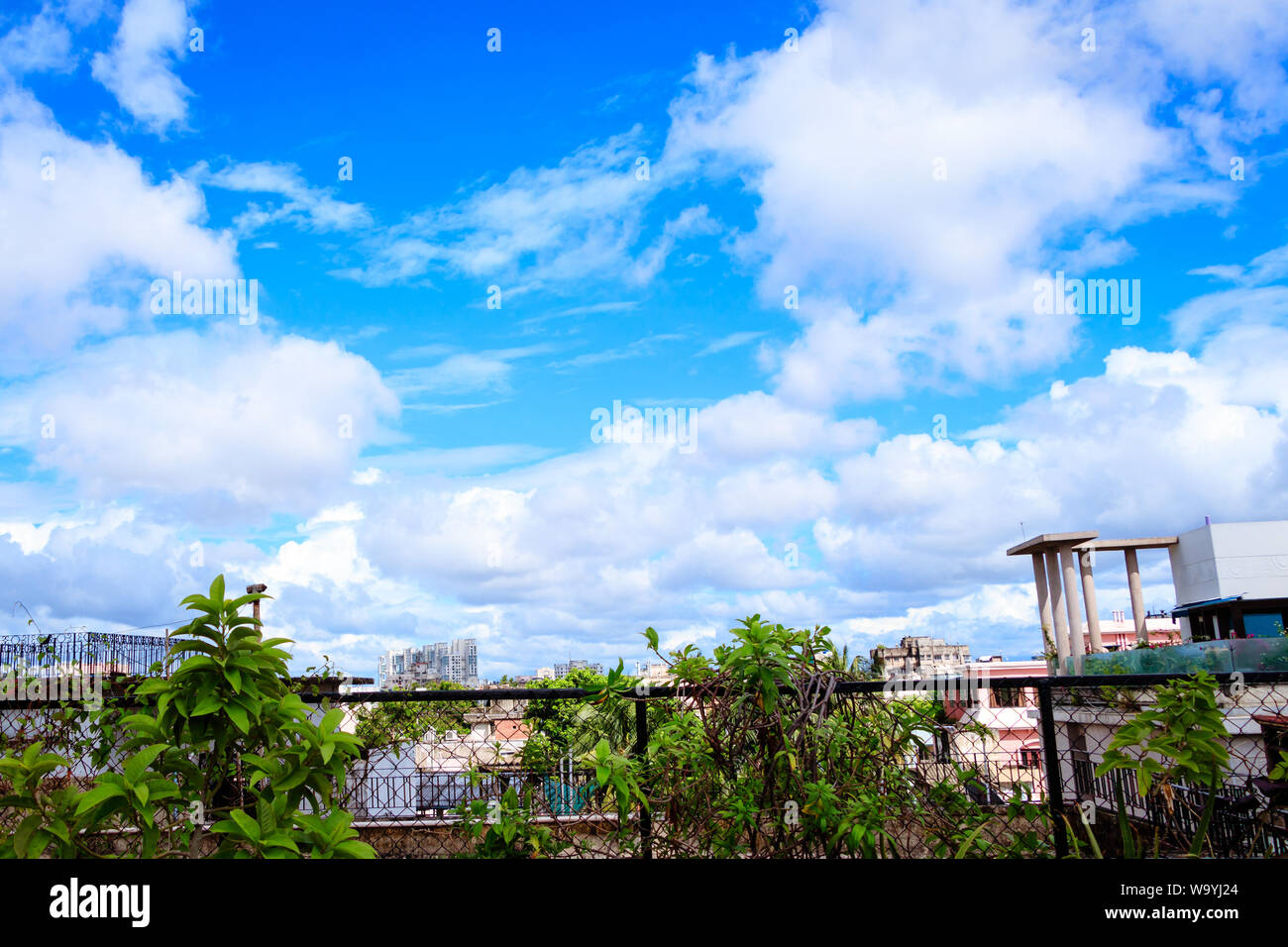 Clouds over rooftop of house and high building in Kolkata, India ...
