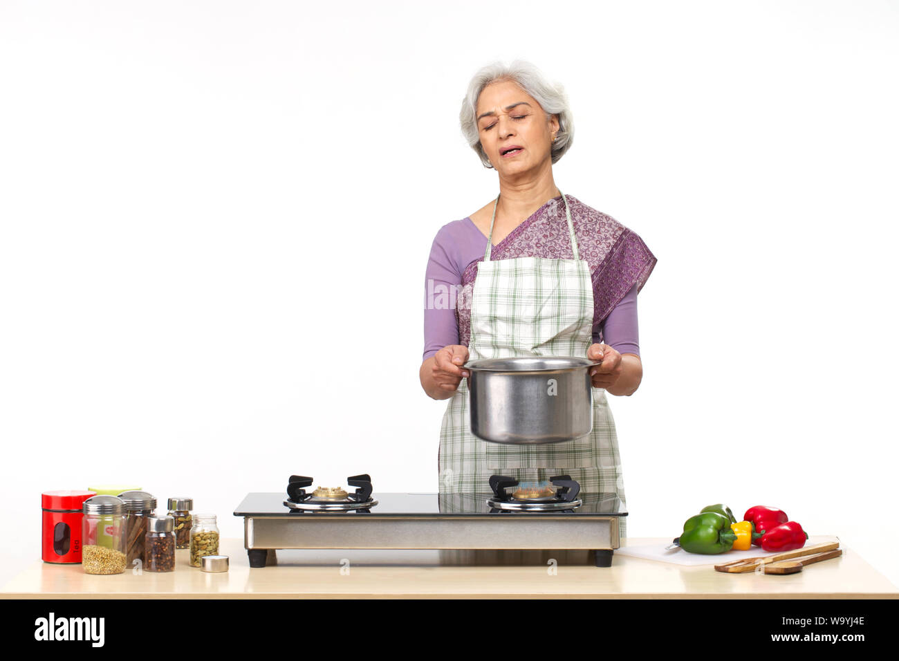 Indian old woman cooking food hi-res stock photography and images - Alamy
