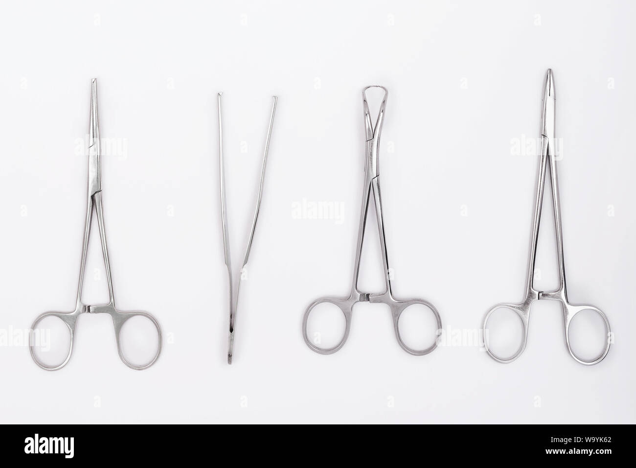 Metal surgical instruments on white background. Flat lay Stock Photo ...