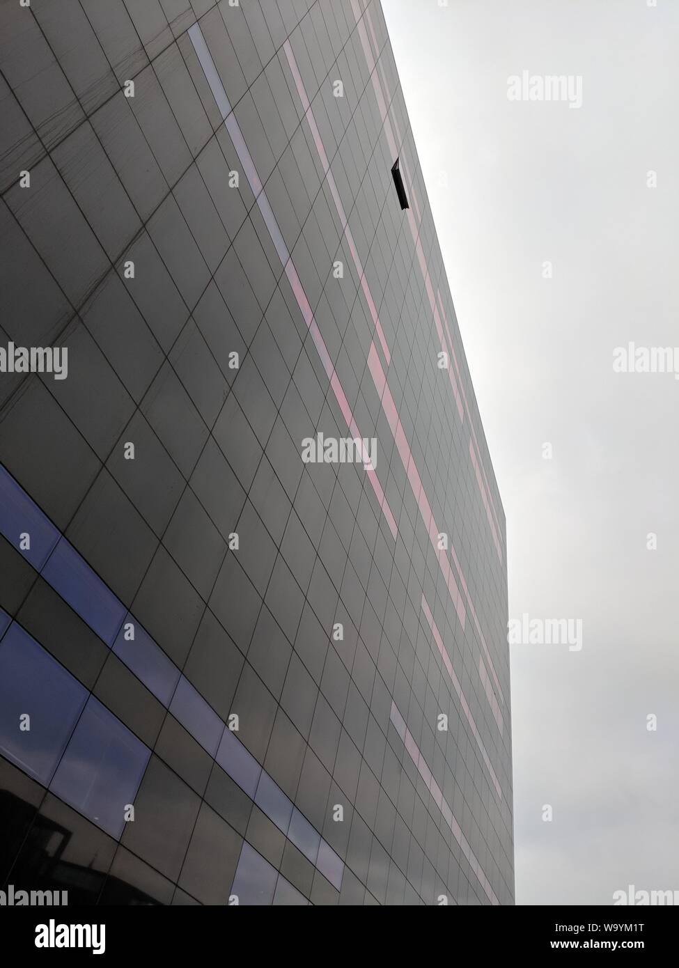 Vertical low angle shot of a high rise black building Stock Photo - Alamy