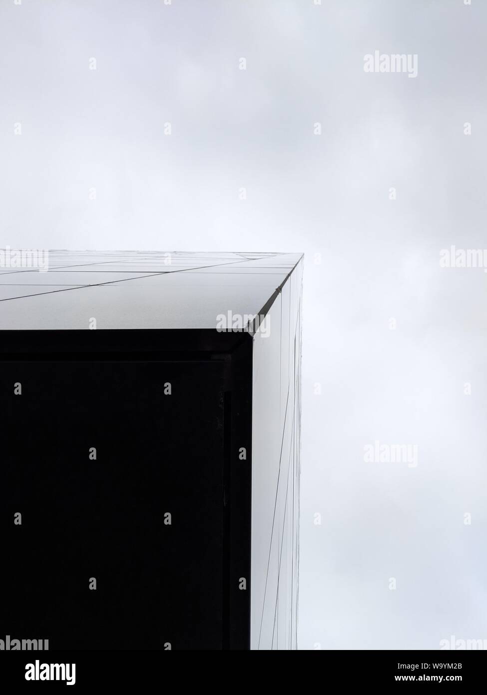 Vertical low angle shot of a high rise triangular building Stock Photo ...