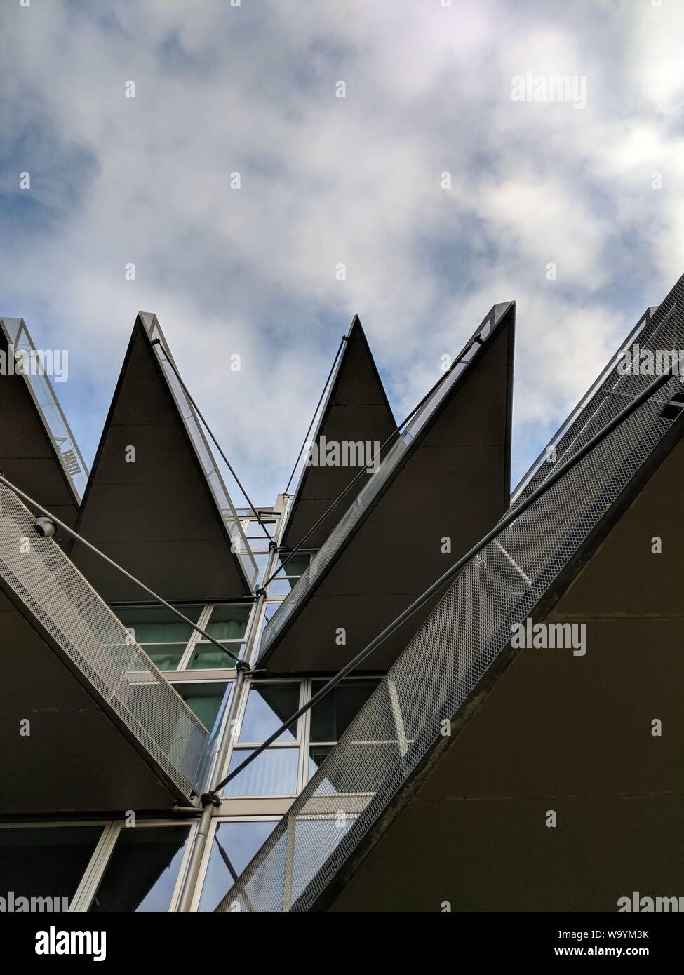 Vertical low angle shot of a high rise building with triangular ...