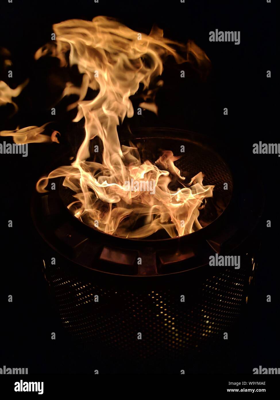 Vertical closeup shot of a fire flame burning inside of a pot Stock ...