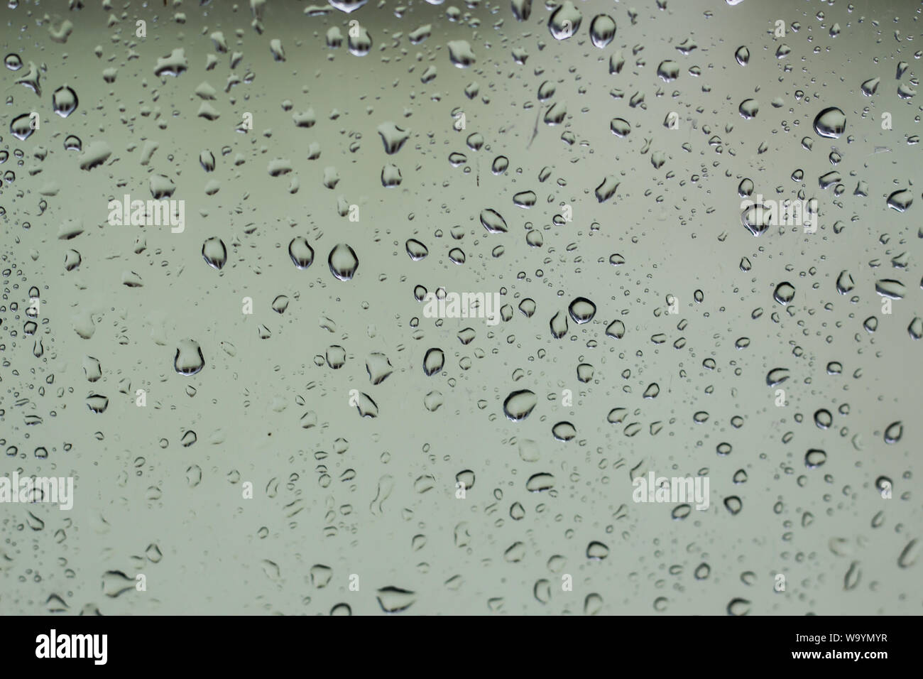 Raindrops on glass during the rainy season Stock Photo - Alamy